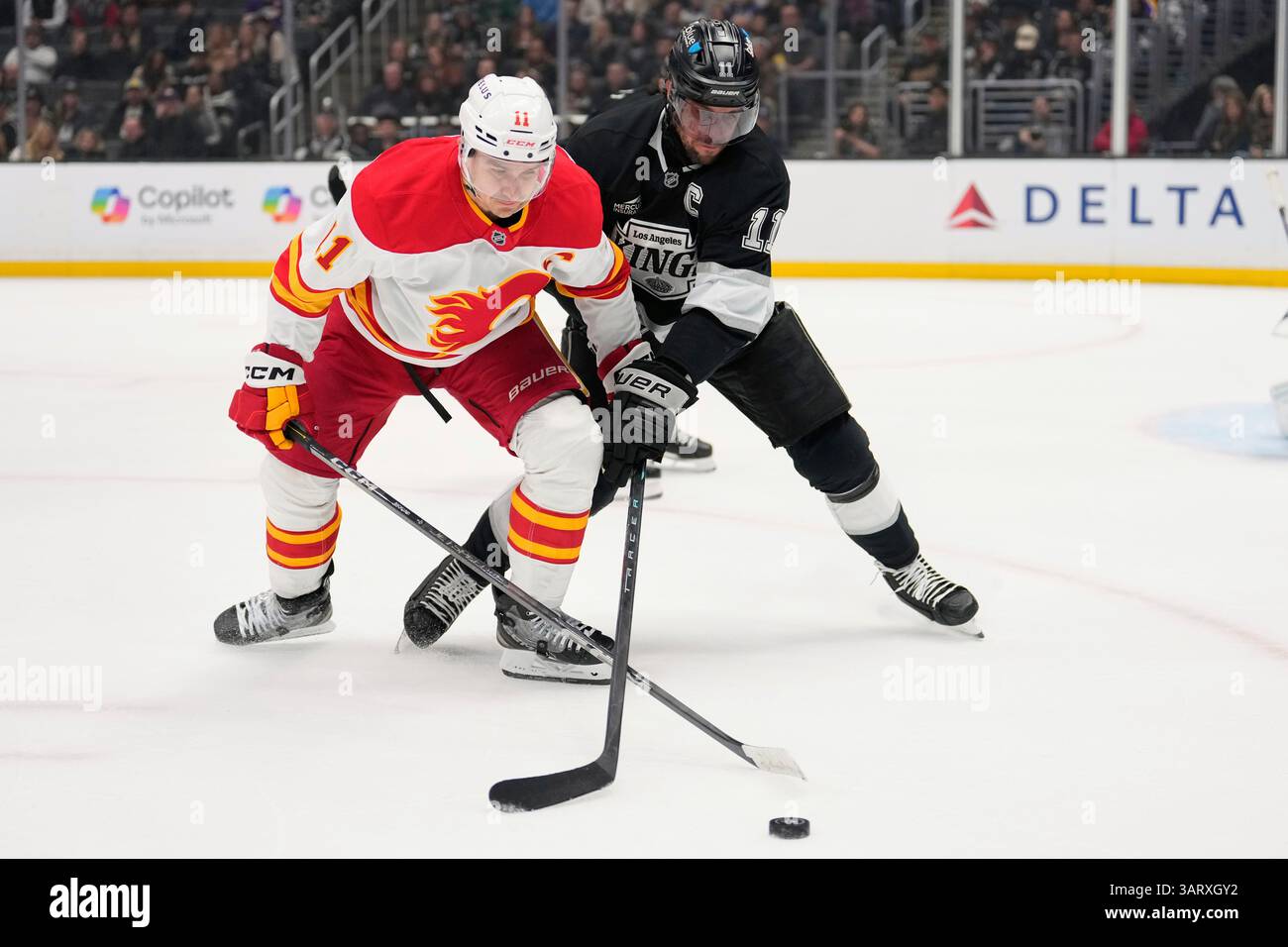 Calgary Flames center Mikael Backlund, left, and Los Angeles Kings ...