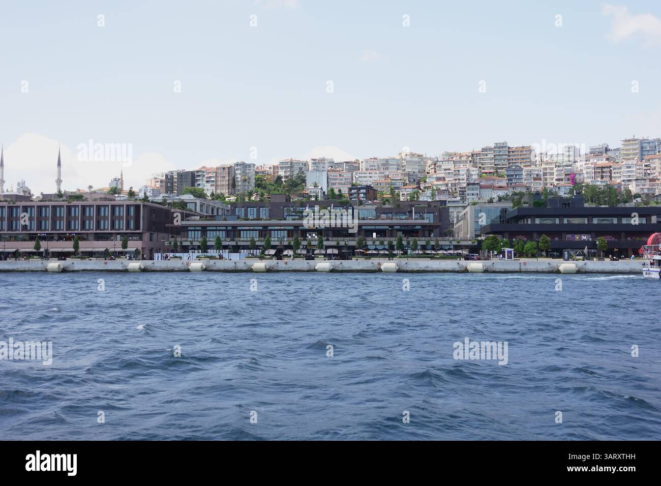 turkey istanbul 15 march 2025. Waterfront view of bustling urban area ...