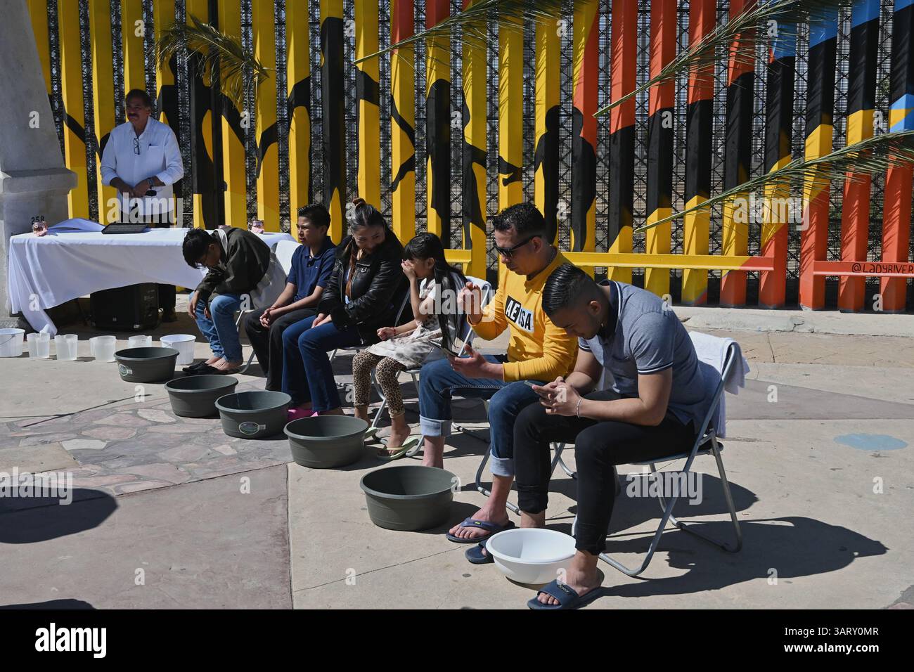 Foot washing migrants hi-res stock photography and images - Alamy