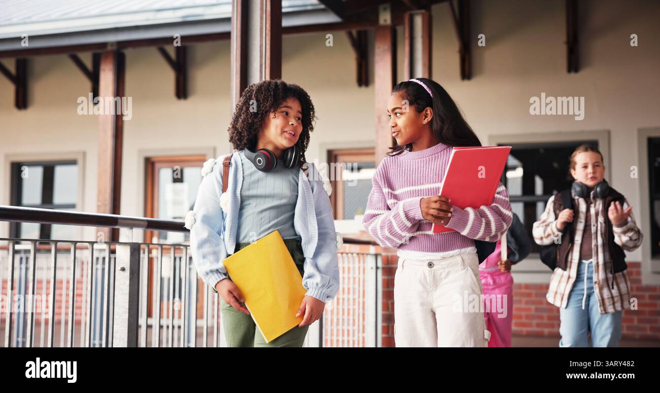 Girl, friends and discussion at school, happy and corridor at break ...
