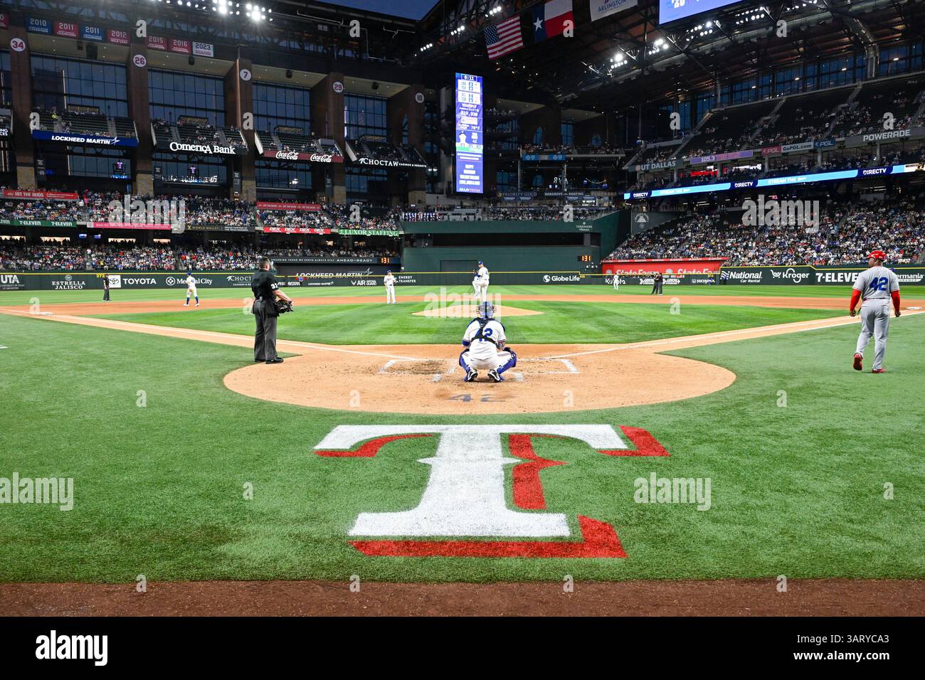 Texas Rangers pitcher Tyler Mahle warms up in between innings during a ...