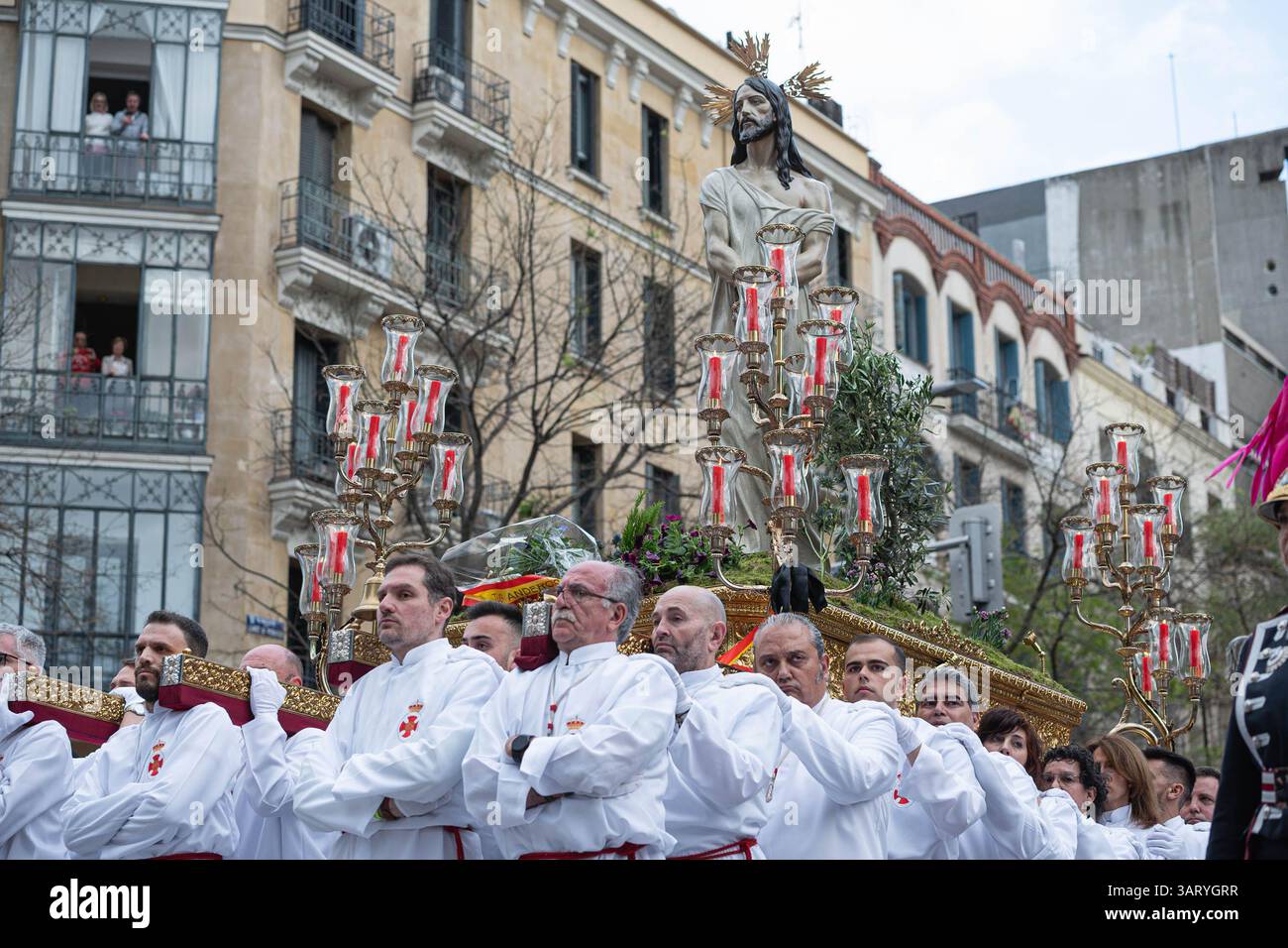 Madrid, Spain. 17th Apr, 2025. Costaleros carry an ornate Holy Week ...