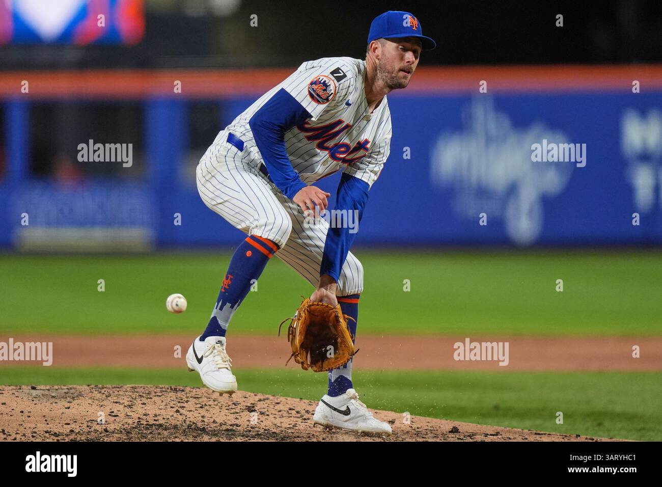 New York Mets pitcher Griffin Canning attempts to catch a ball hit by ...