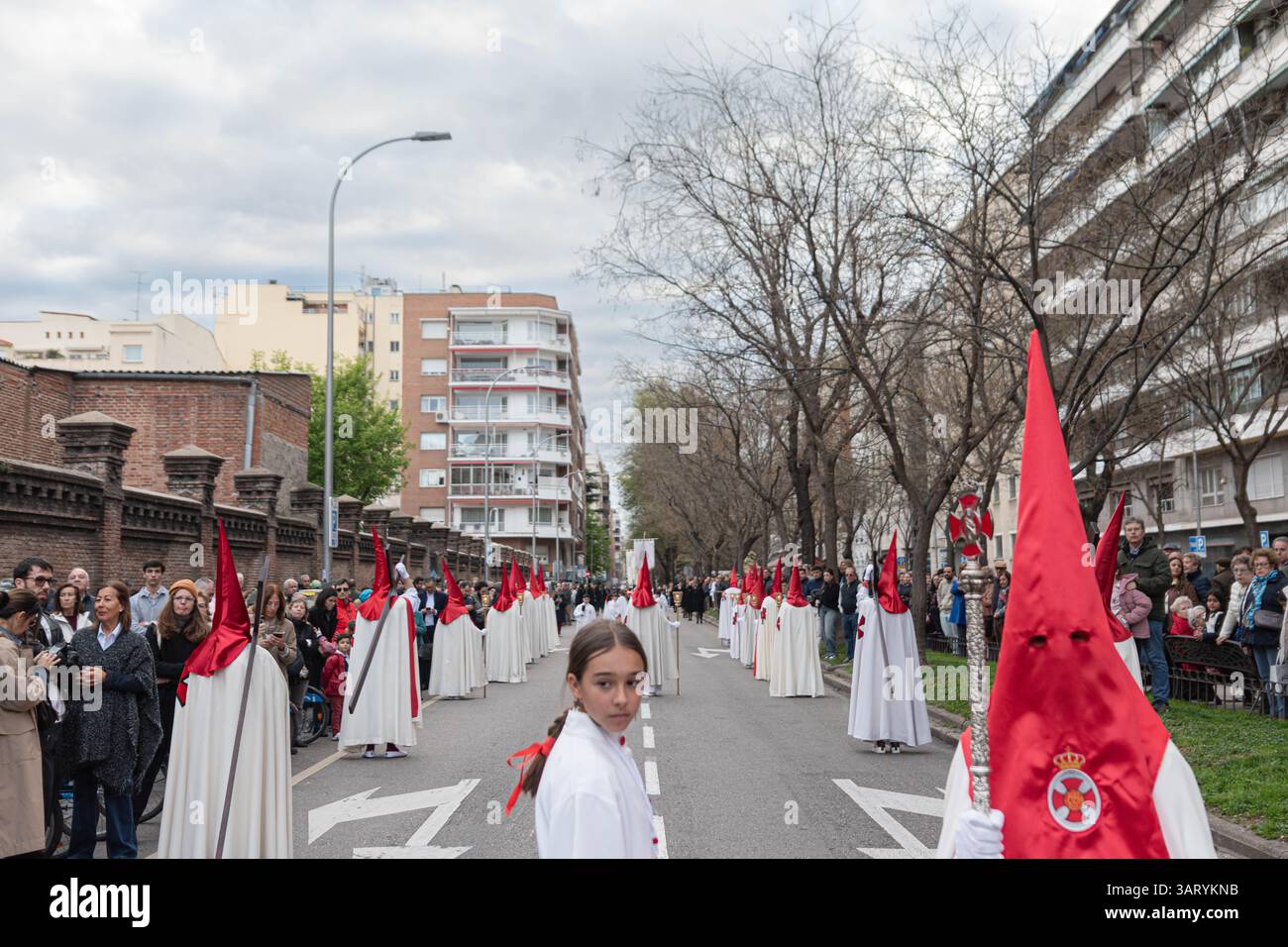 Madrid, Spain. 17th Apr, 2025. Nazarenes dressed in white robes and red ...