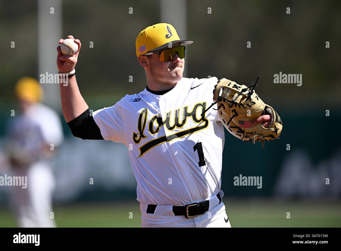 Iowa infielder Caleb Wulf (1) throws during an NCAA college baseball ...