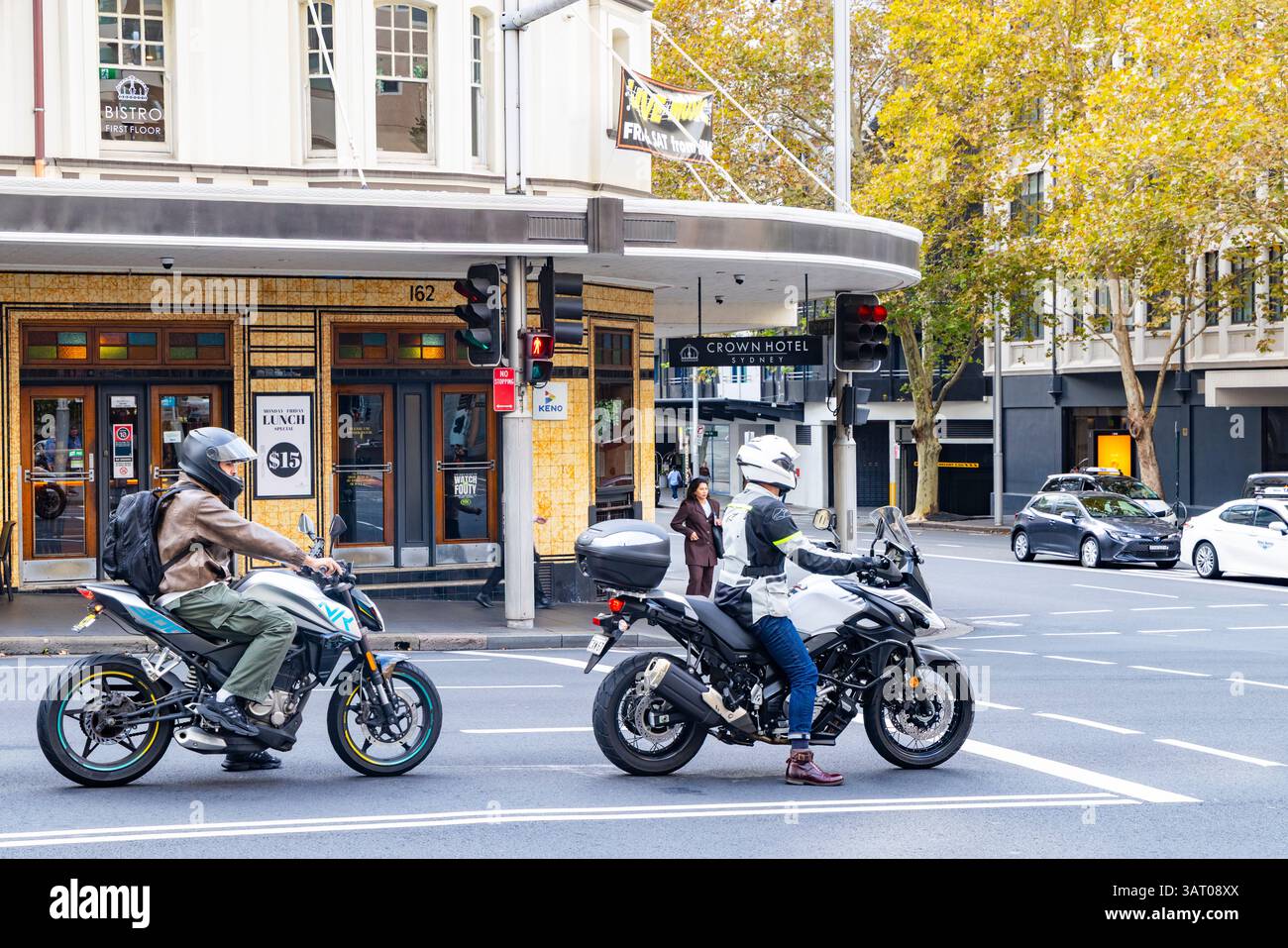 Motorcyclists on their motorbikes at traffic lights in Sydney city ...