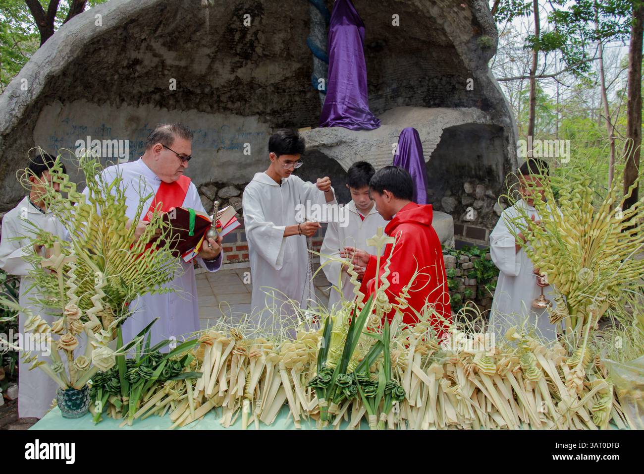 Mae Sot, Thailand. 13th Apr, 2025. A priest leads the Palm Sunday mass ...