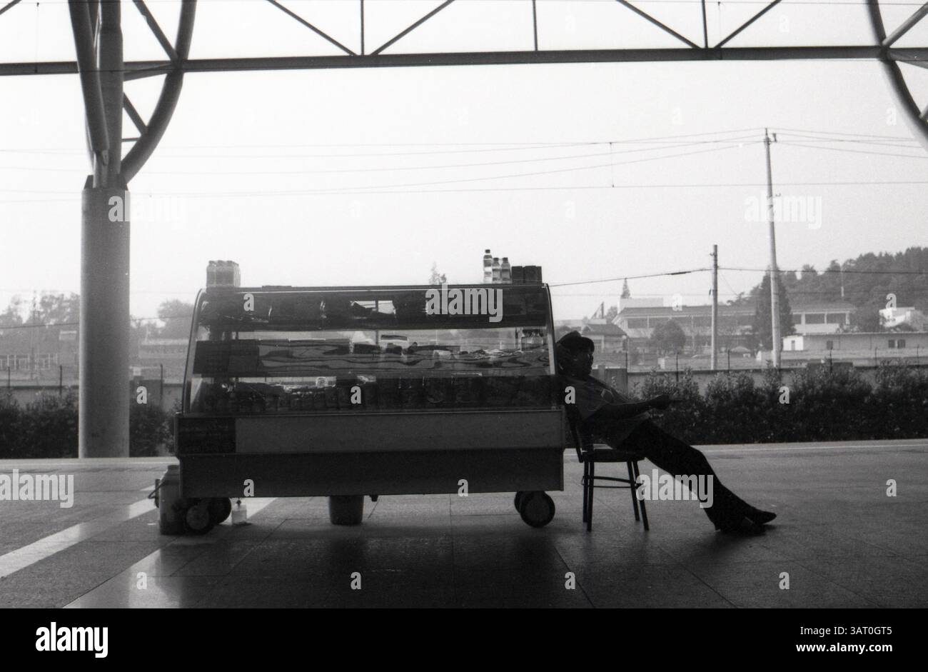 Snack Cart Vendor Leaning Back on Jinan Railway Station Platform, Early ...