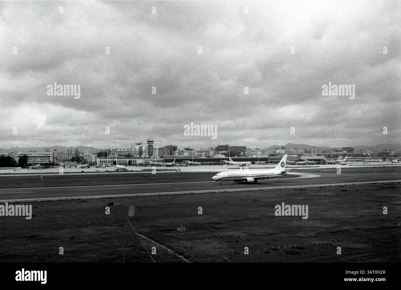Busy airport runway with a Boeing airplane preparing for takeoff amid ...