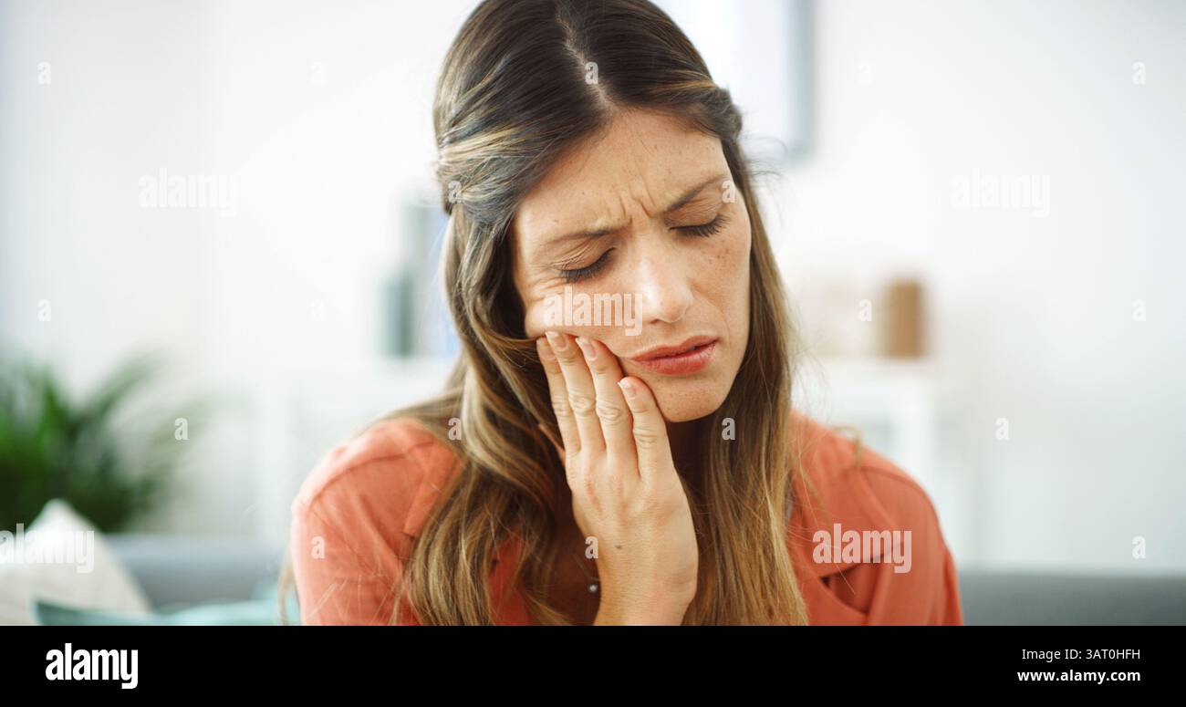 Woman, sore mouth and toothache at house from dental cavity, tooth extraction and gum infection ...