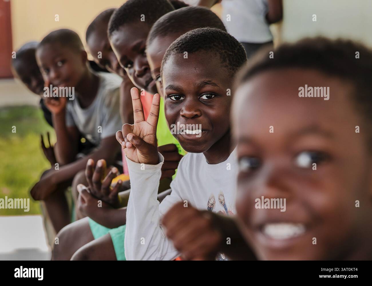 Children making a peace sign with their hands. Snapshot. It was taken ...