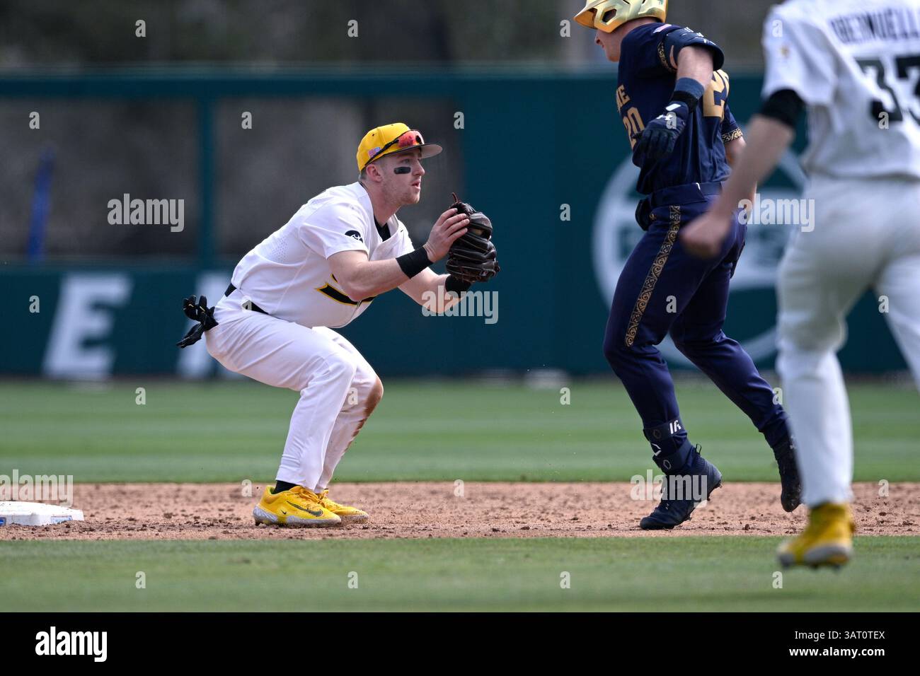 Iowa infielder Gable Mitchell, left, tags out Notre Dame's Nick DeMarco ...