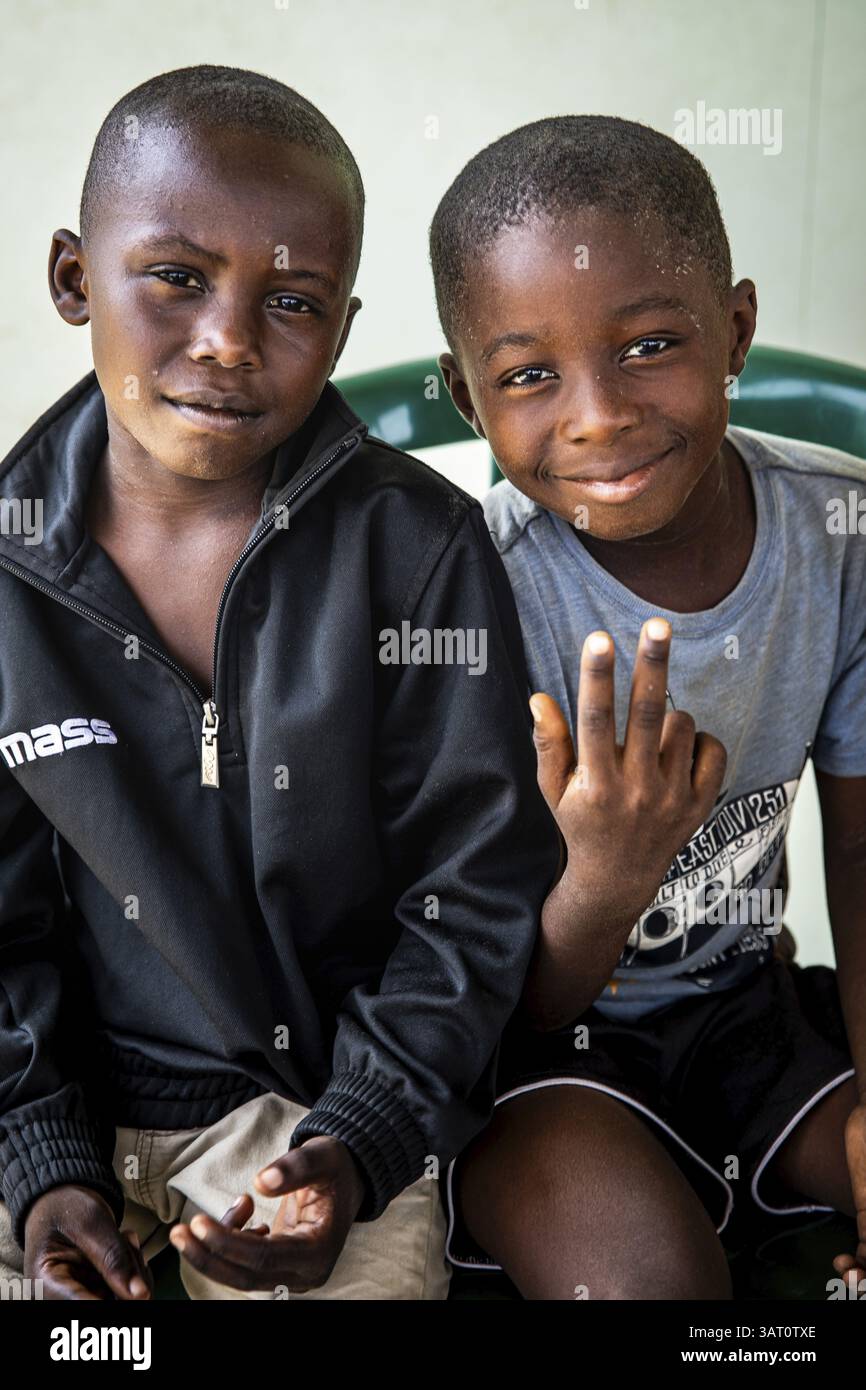 Two children. Snapshot. It was taken during a rubbish collection ...