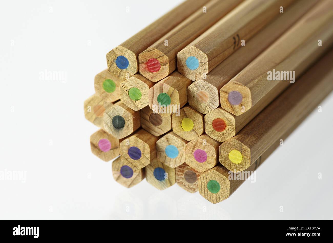 Coloured pencils stacked in wooden casing Stock Photo - Alamy