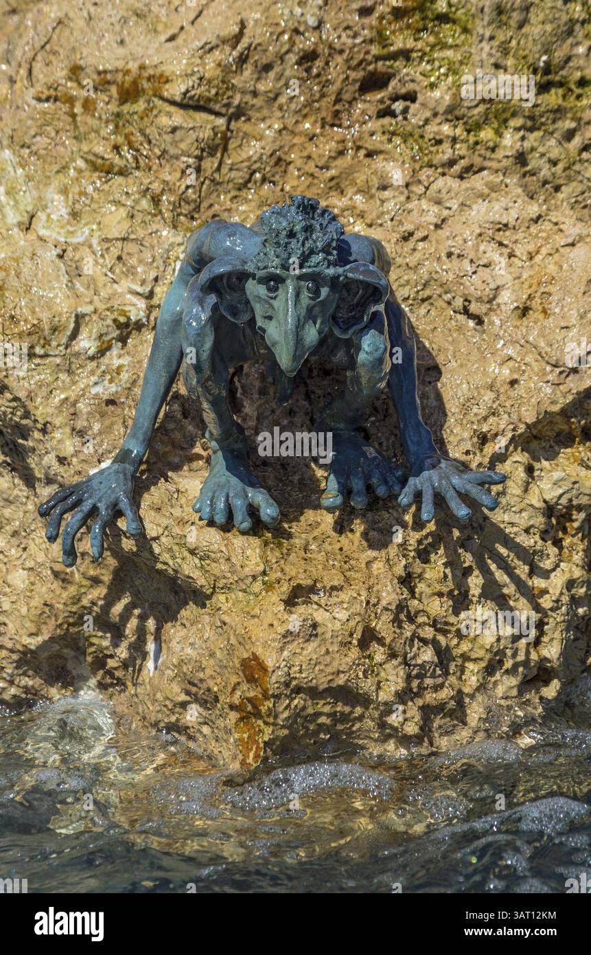 Mythical creature figure by the water Stock Photo - Alamy