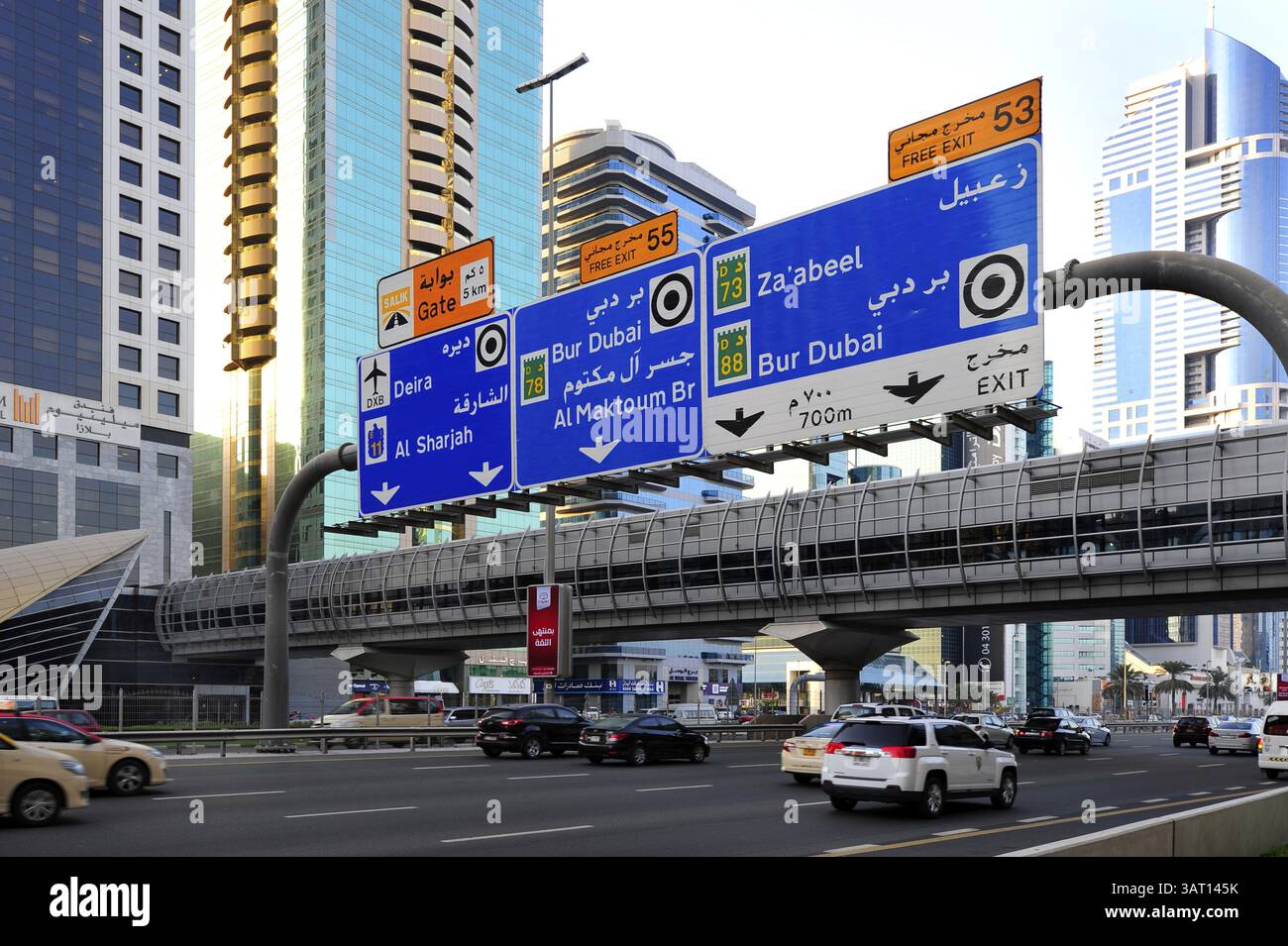 Pedestrian overpass and traffic signs on Sheikh Zayed Road, Dubai ...