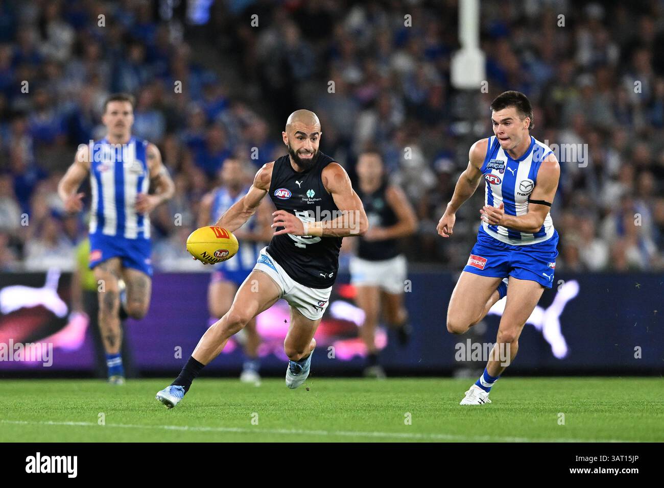 Melbourne, Australia. 18th Apr, 2025. Adam Saad of Carlton (centre) in ...