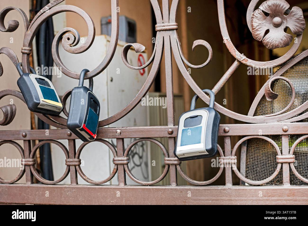 modern locks on forged gates next to the intercom. Protection and ...