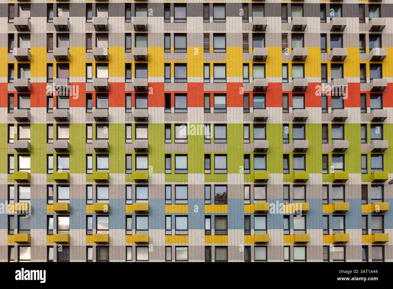 A fragment of the wall of a modern multi-storey building with identical ...