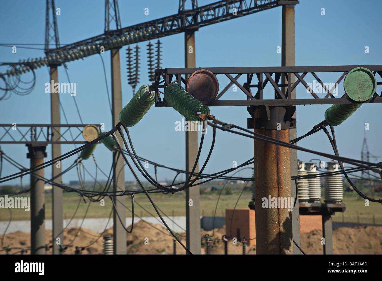 High-voltage towers with power grids Stock Photo - Alamy