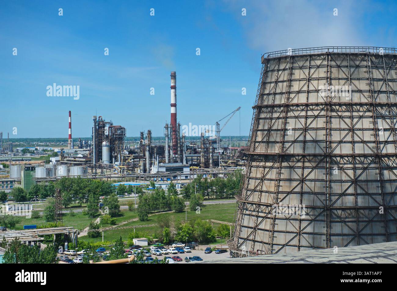 Pipes and cooling towers of a large heating plant Stock Photo - Alamy