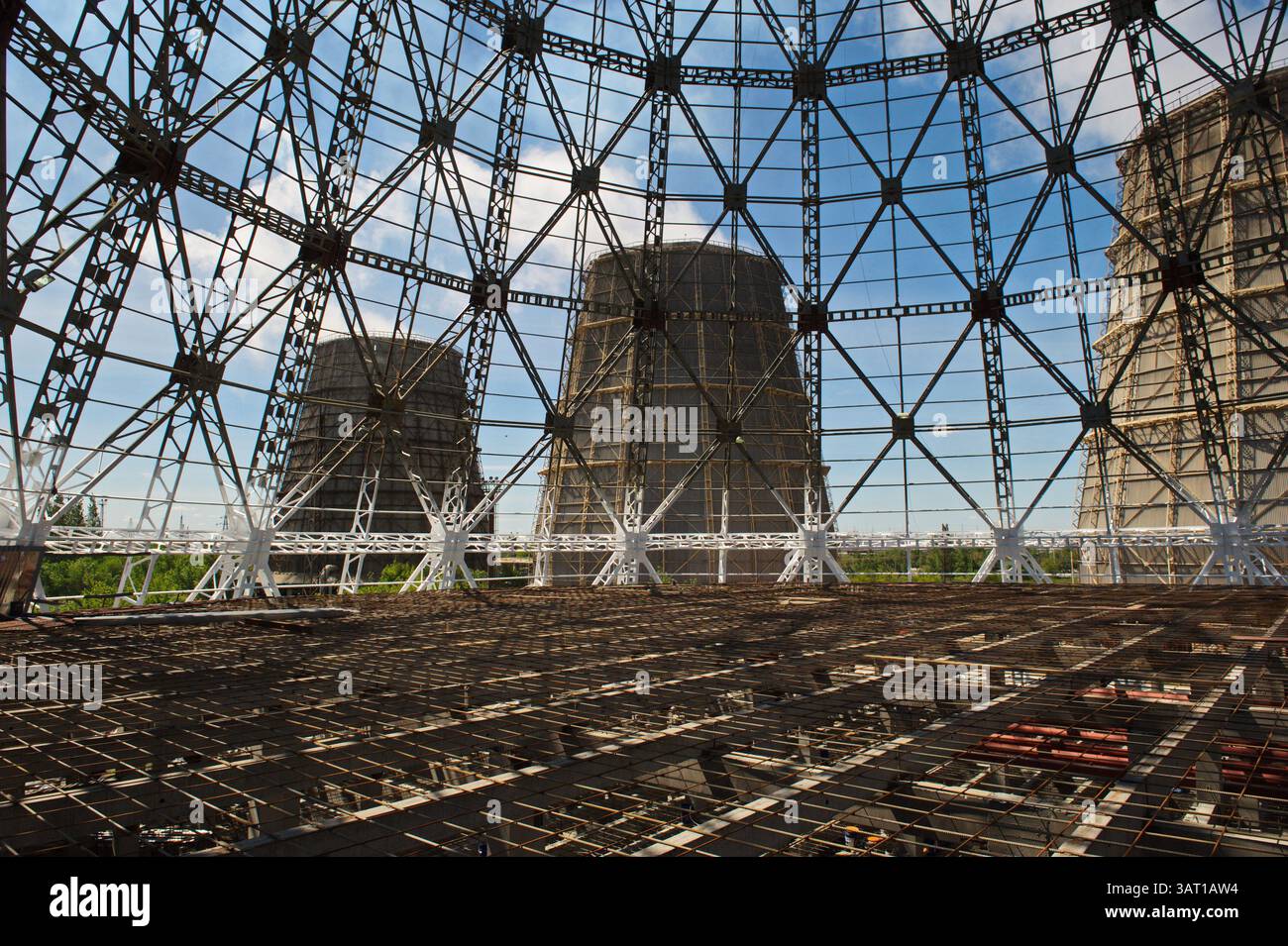 Pipes and cooling towers of a large heating plant Stock Photo - Alamy