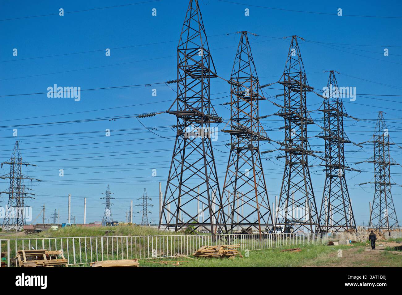 High-voltage towers with power grids Stock Photo - Alamy