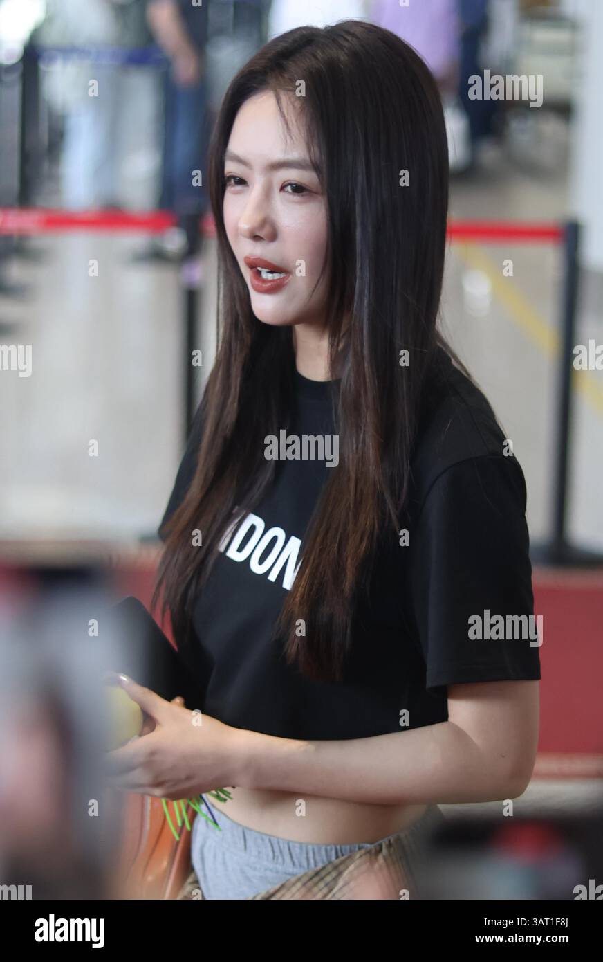 Chinese actress Cai Wenjing appears at the airport in Shanghai, China, 17 April, 2025 Stock ...