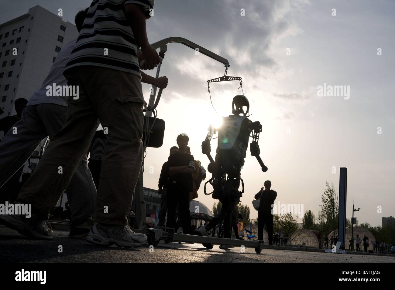 Beijing,China.17th April 2025. A humanoid robot runs at Beijing Esports ...