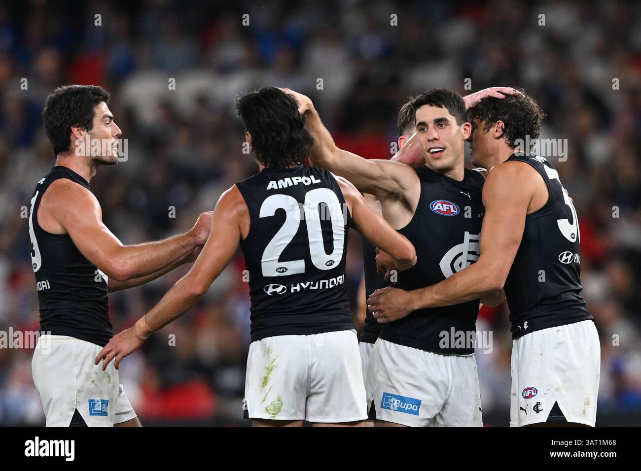 Adam Cerra of Carlton celebrates with team mates after kicking a goal ...