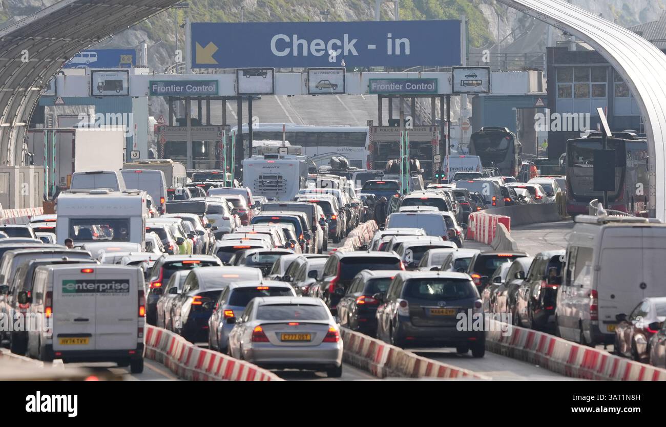 Cars queue at check-in to board ferries at the Port of Dover in Kent. Train passengers are being ...