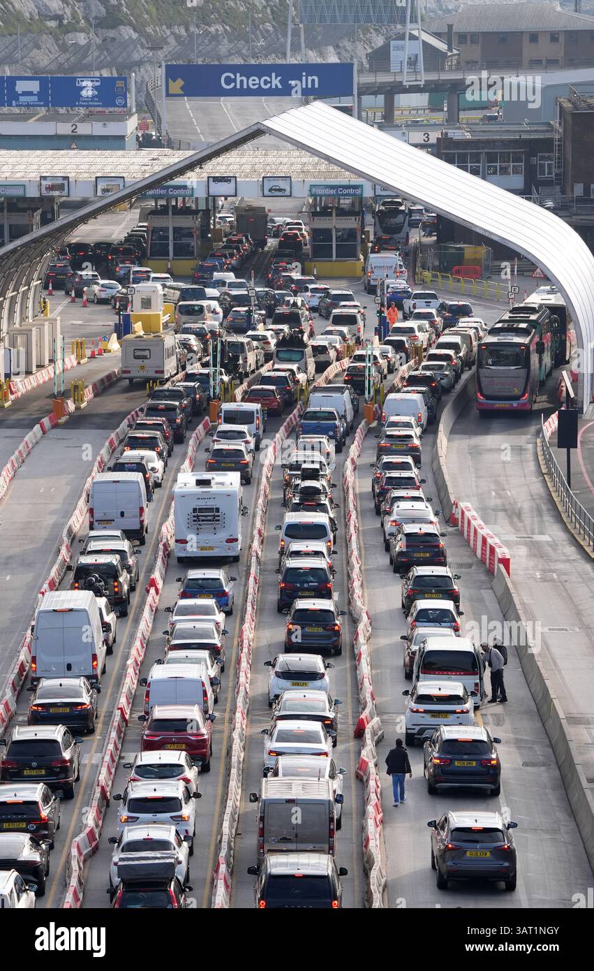 Cars queue at check-in to board ferries at the Port of Dover in Kent. Train passengers are being ...