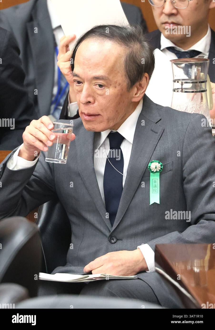 Tokyo, Japan. 18th Apr, 2025. Bank of Japan Governor Kazuo Ueda drinks ...