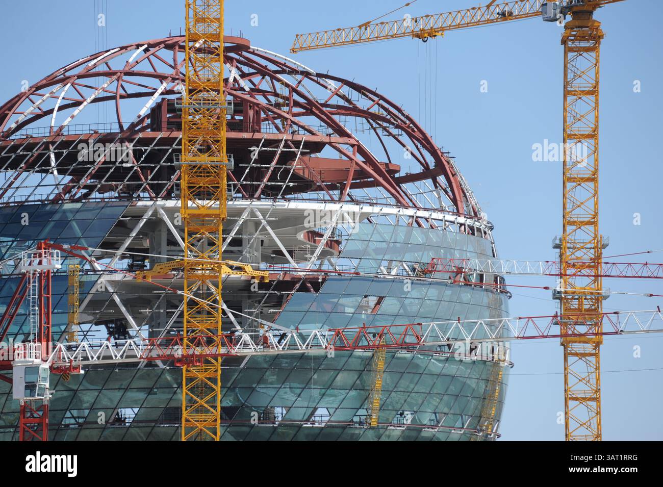 Workers are building a huge complex of pavilions for the EXPO ...