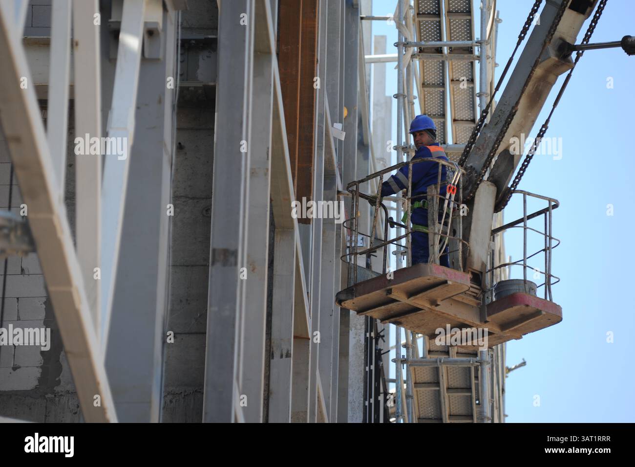 Workers are building a huge complex of pavilions for the EXPO ...
