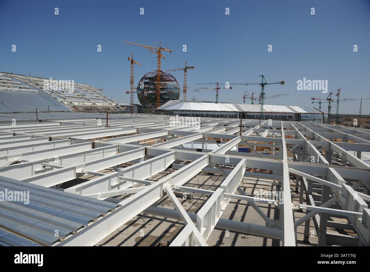 Workers are building a huge complex of pavilions for the EXPO ...