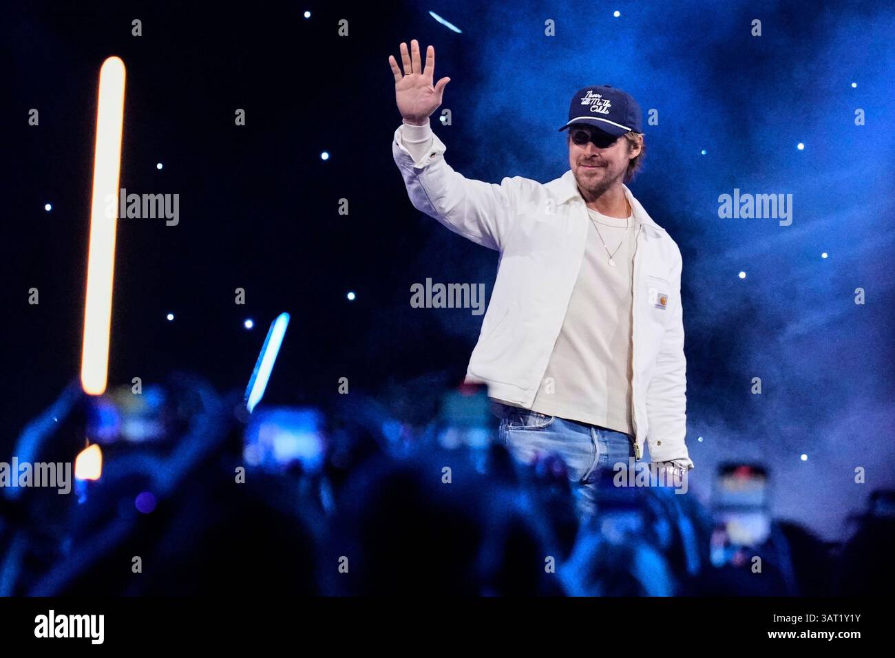 Actor Ryan Gosling waves at audience members during a fan convention called the Star Wars ...