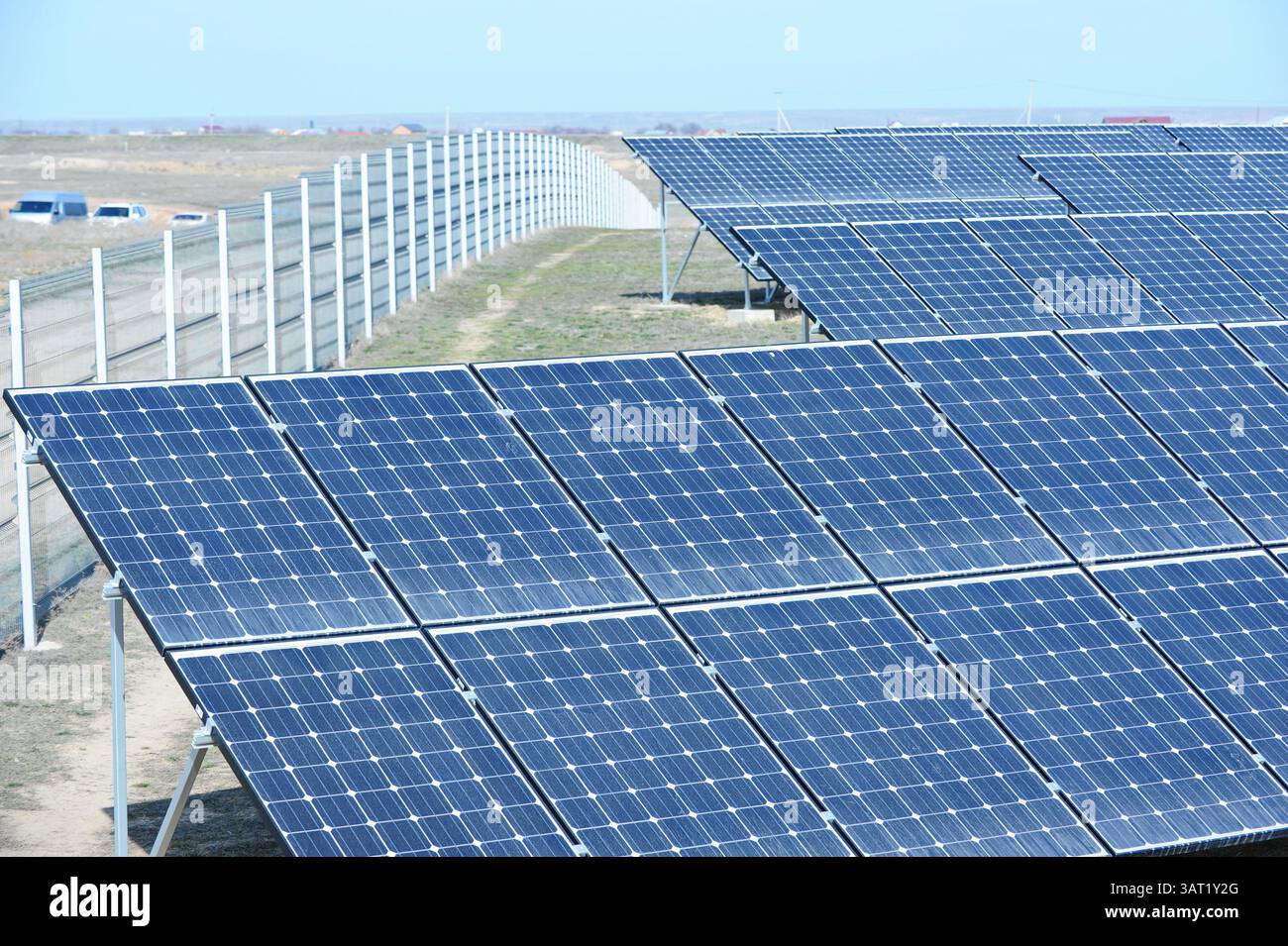 Solar panels of different sizes are lined up in a row to collect energy ...