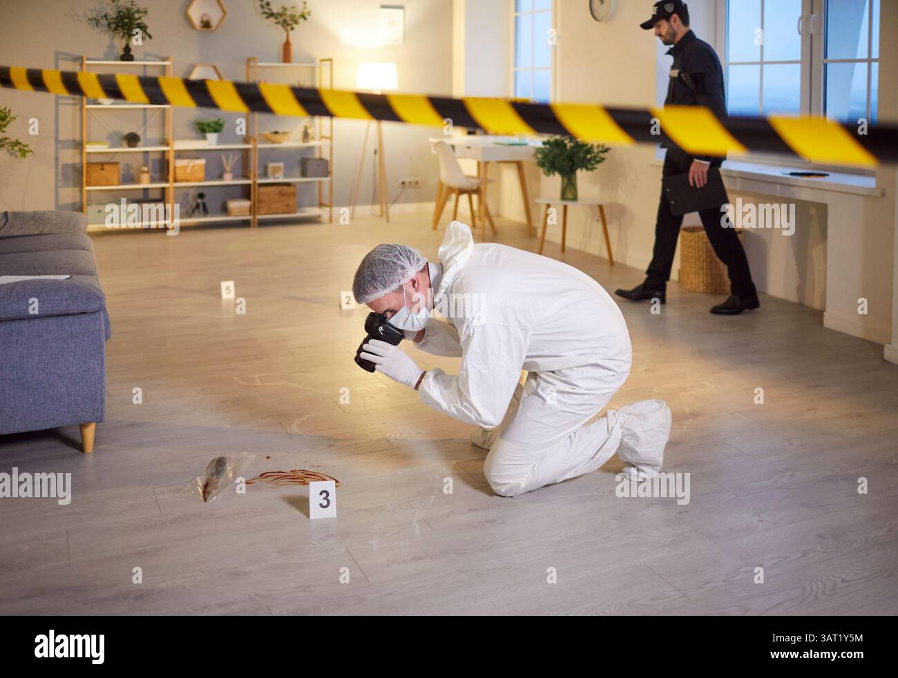 Criminologist And Police Officer Collecting Evidence At Crime Scene ...