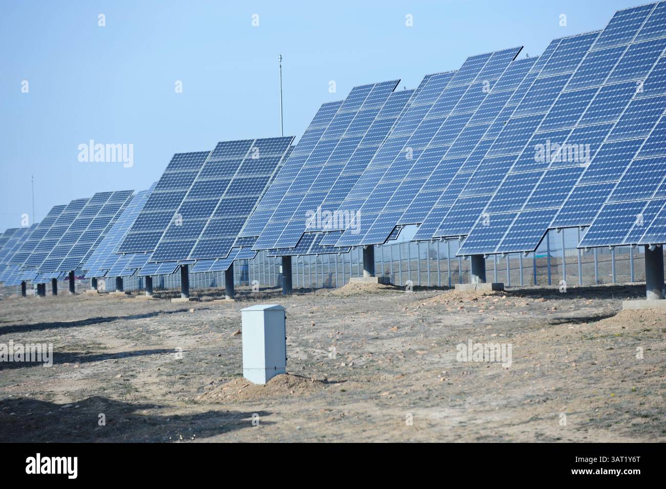 Solar panels of different sizes are lined up in a row to collect energy ...