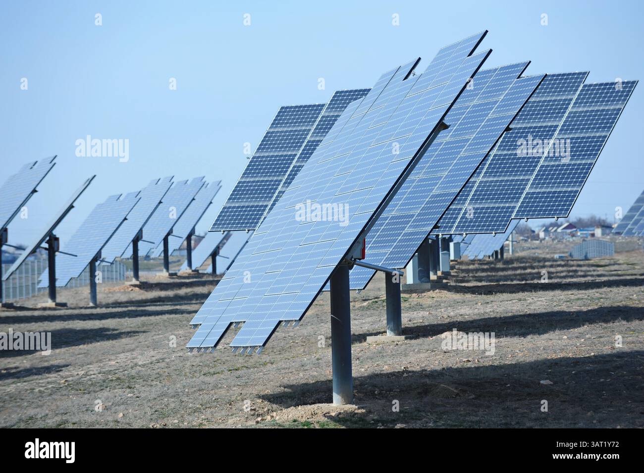 Solar panels of different sizes are lined up in a row to collect energy ...