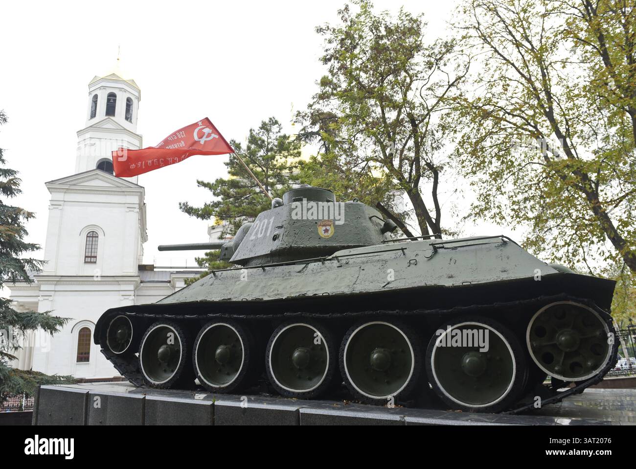 Soviet monument with a tank and a flag with the inscription: Glory to ...