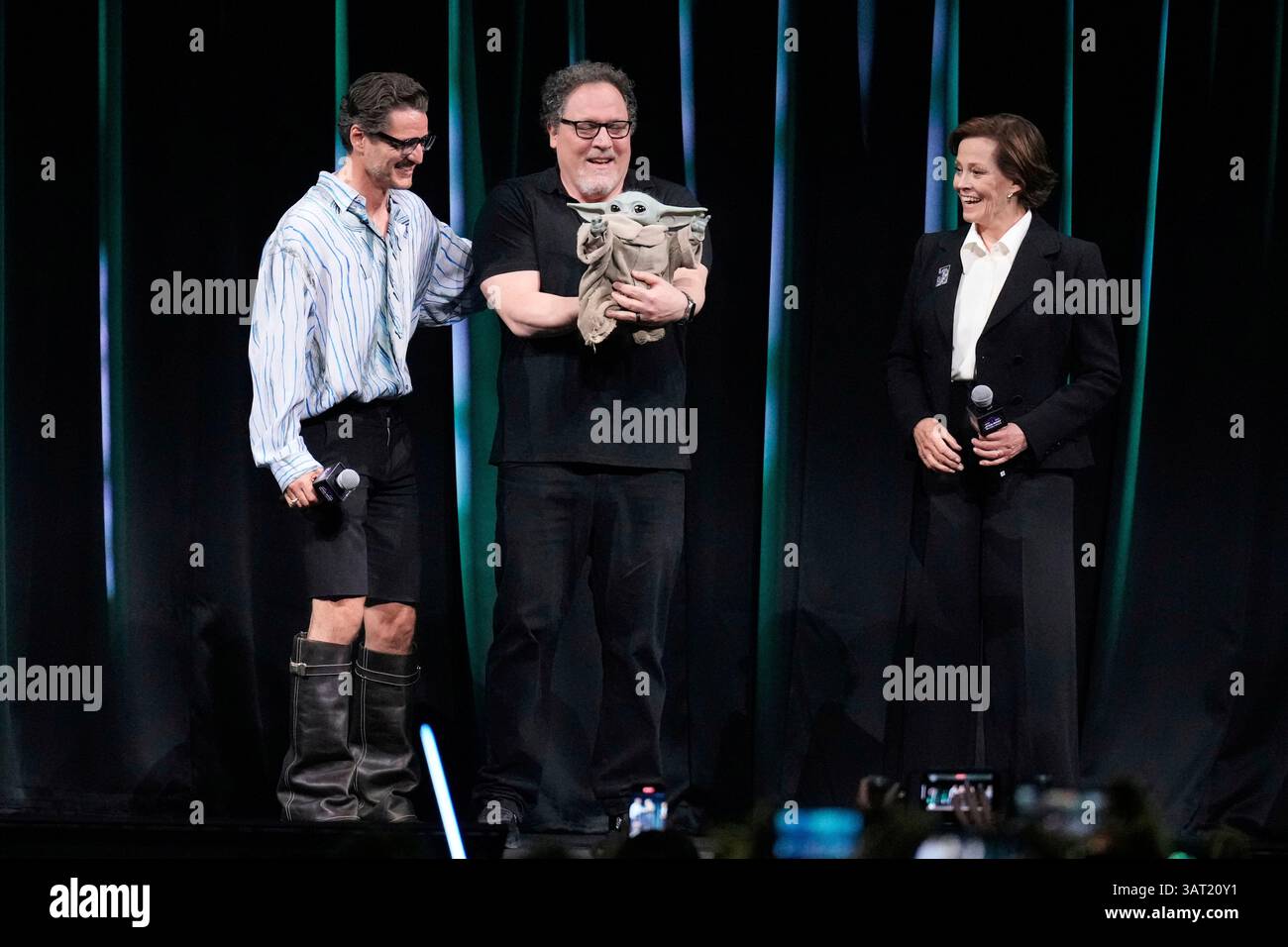 Actor Pedro Pascal, left, and Sigourney Weaver, right, with director ...