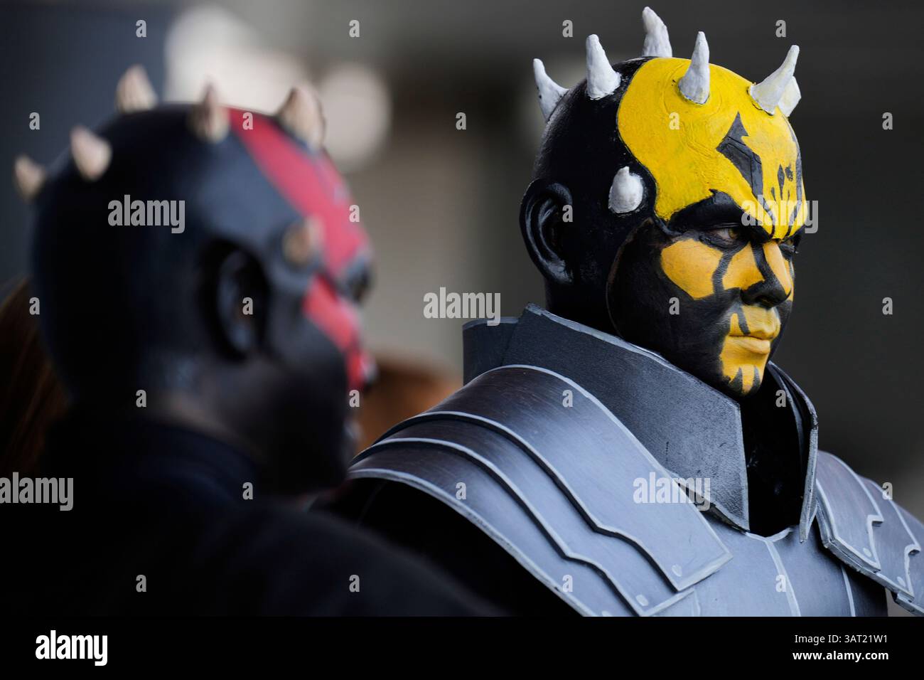 Star Wars fans wearing costumes of Darth Maul, left, and his brother ...