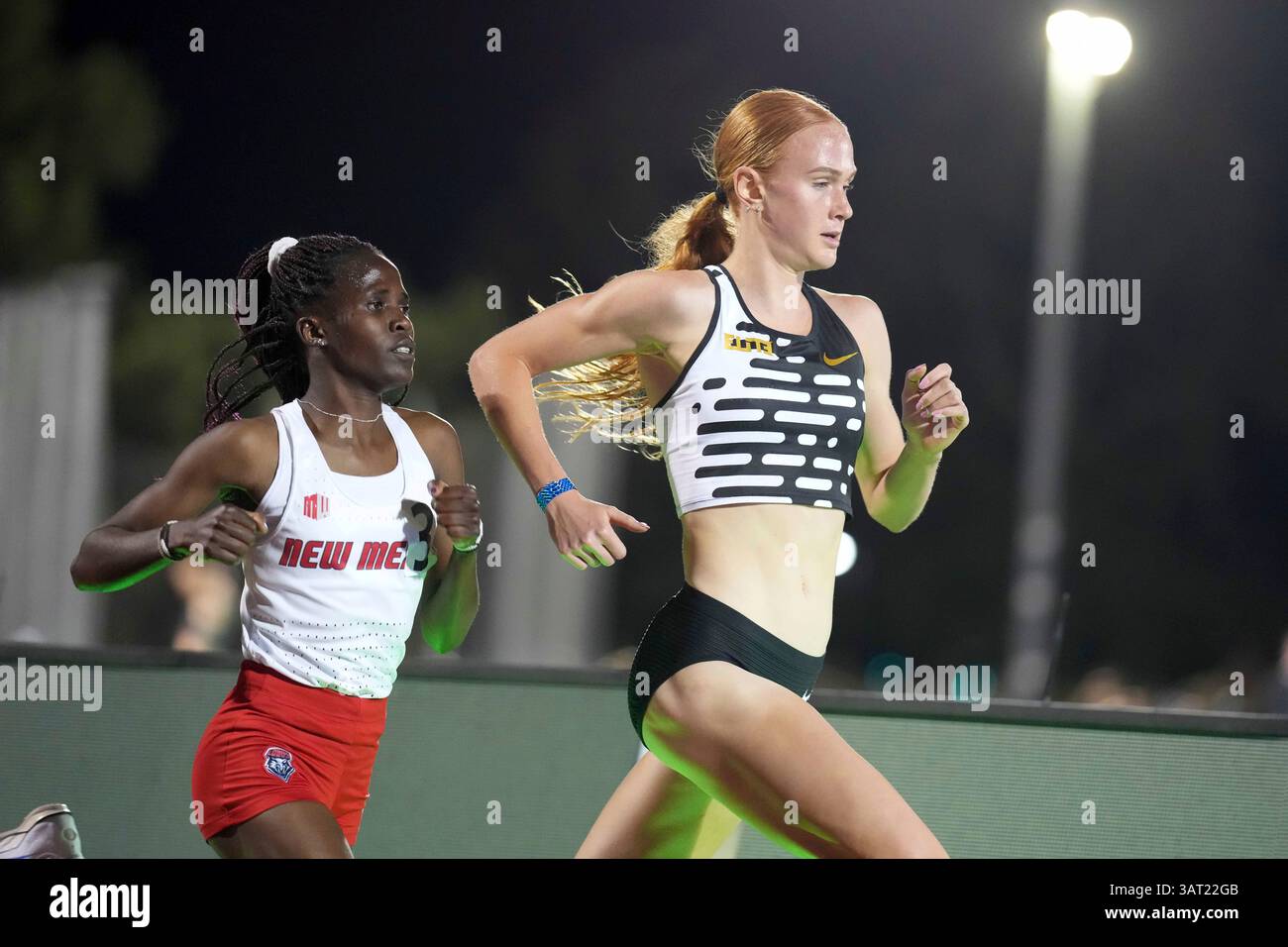 Jane Hedengren leads Pamela Kosgei of New Mexico in the women's 5,000m ...