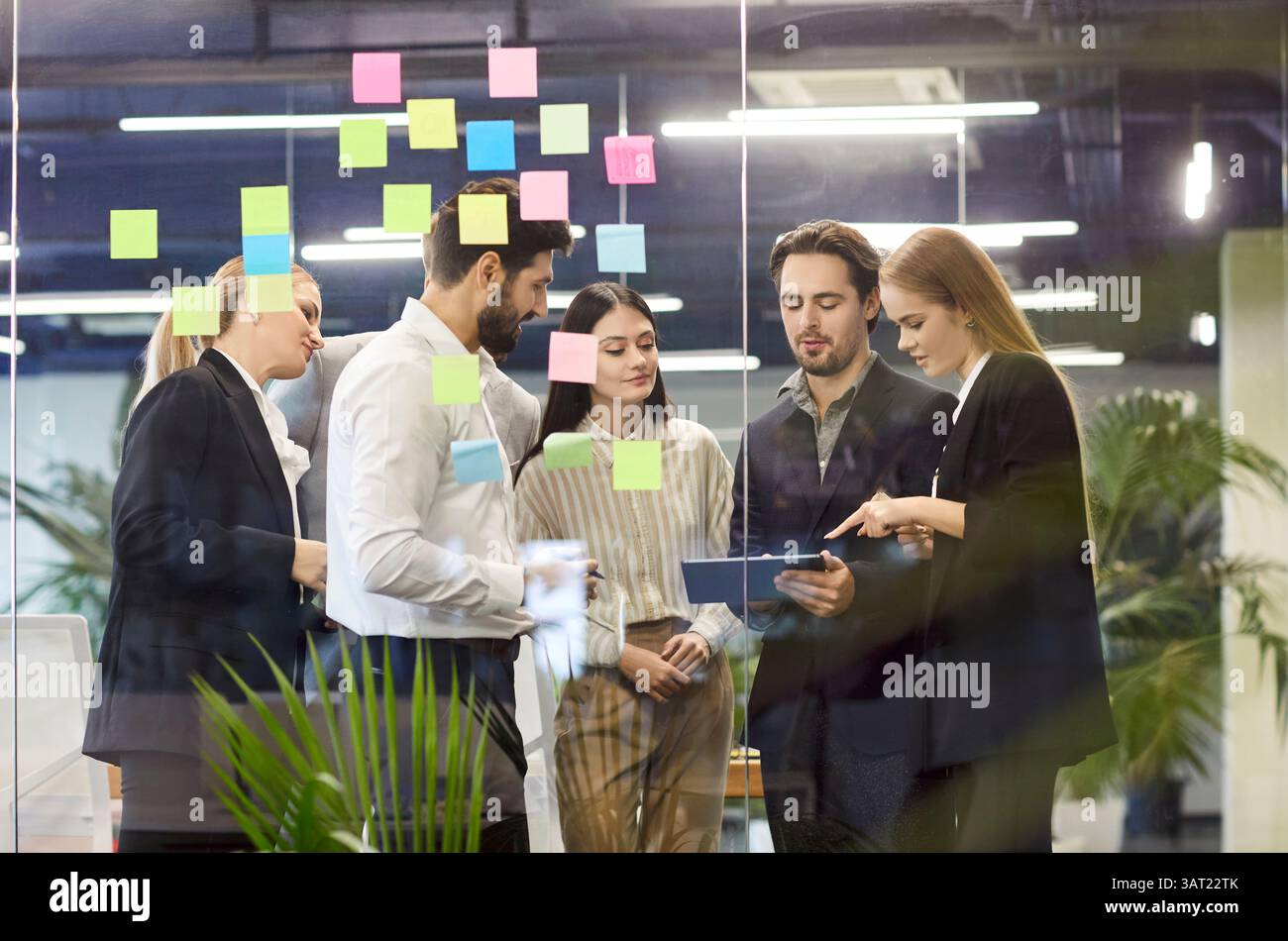 Business Team Engaged In Conversation During Office Meeting Stock Photo ...