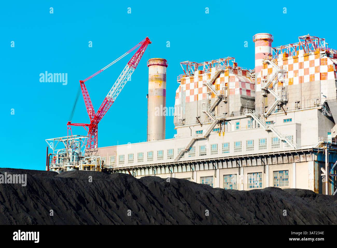Coal processing plant, with pipes, a crane and a pile of coal Stock ...