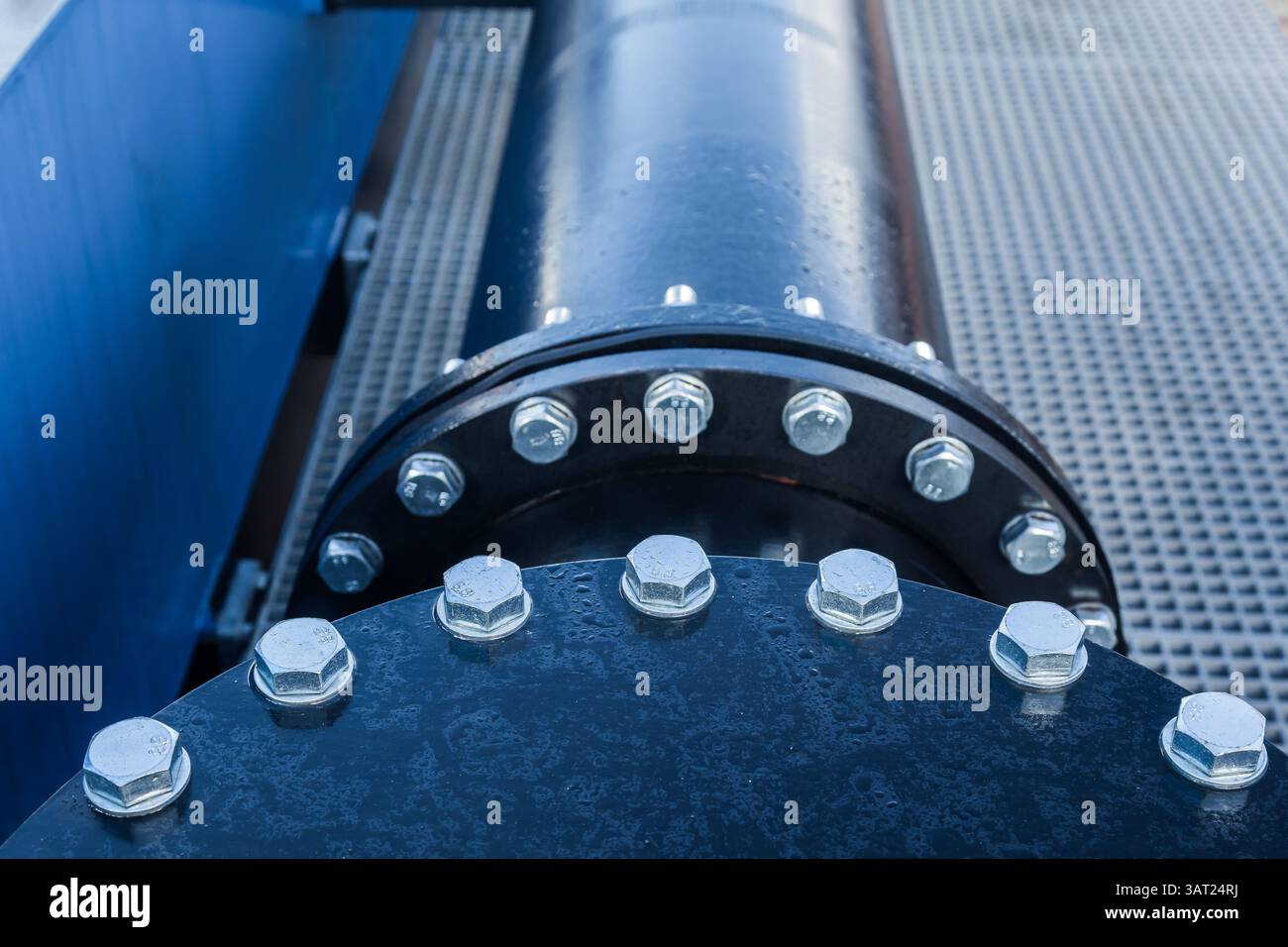 Large pipe connection with a large number of bolts and nuts enclosed on ...