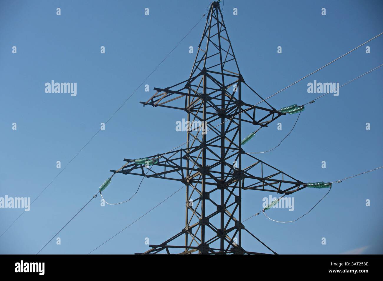 High-voltage power lines with insulators, stabilizers and transformers ...