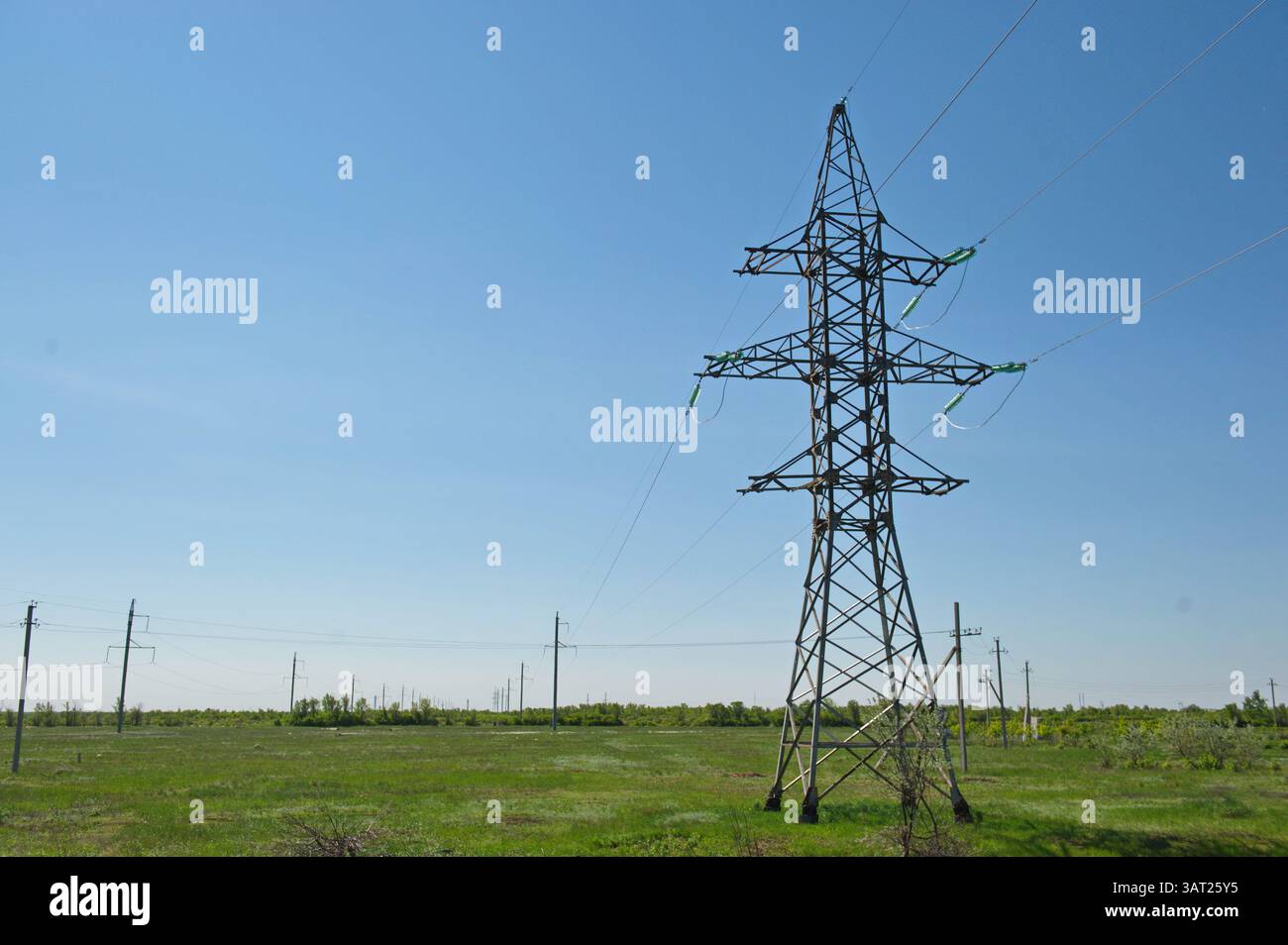 High-voltage power lines with insulators, stabilizers and transformers ...